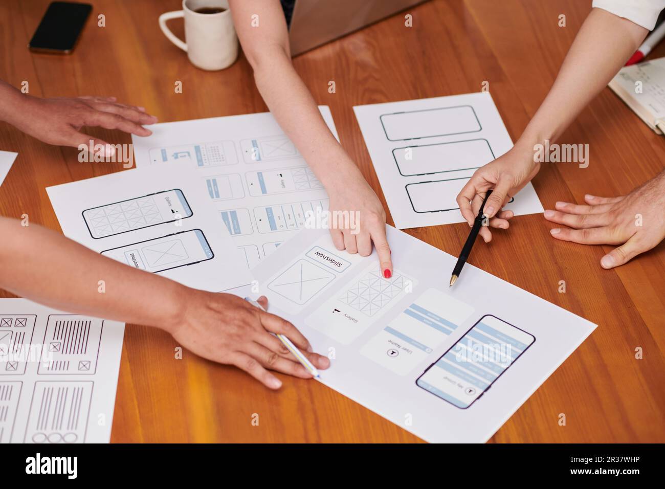 Closeup image of project manager and ui and ux designers discussing ...