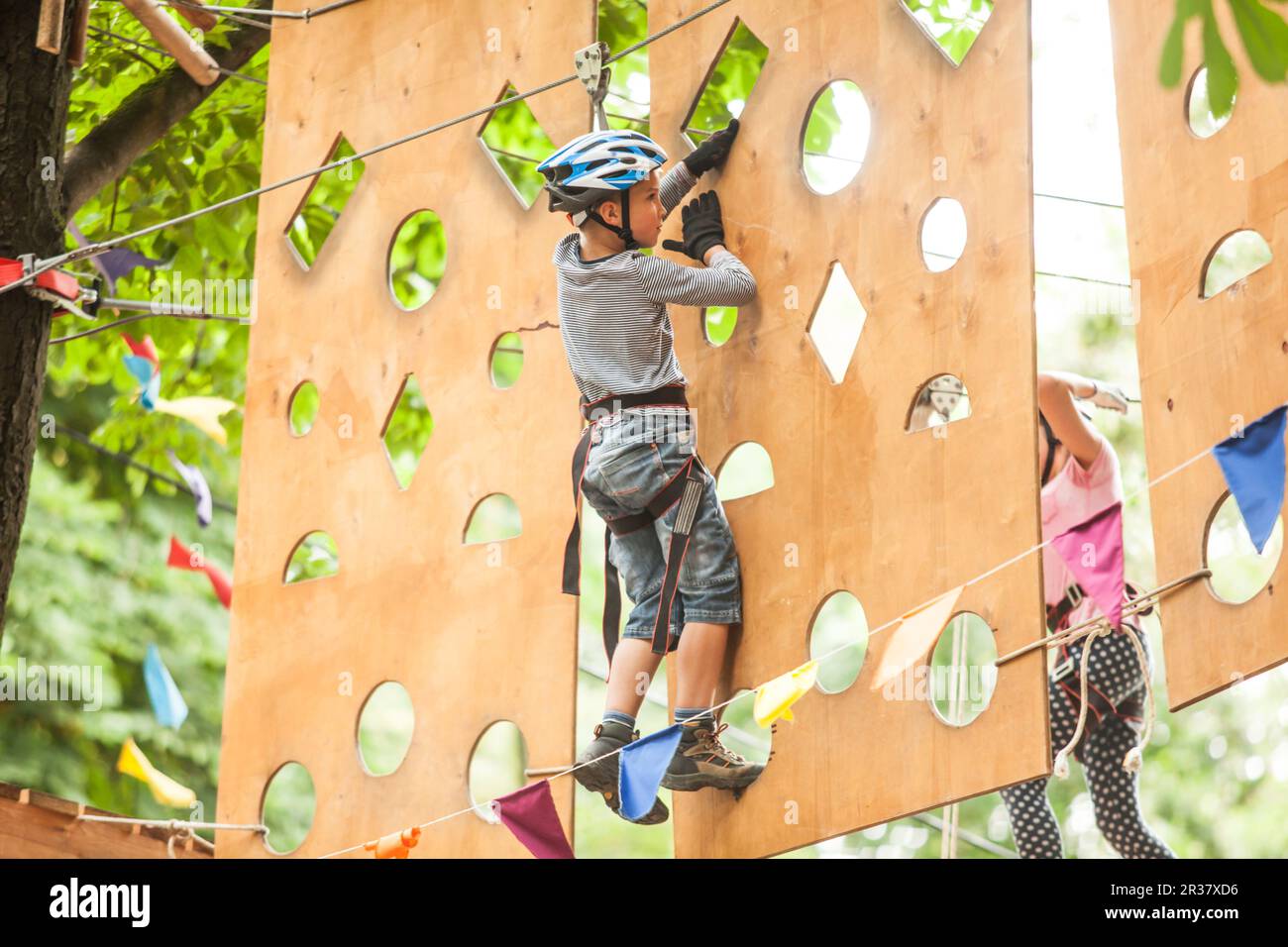 Child in a adventure playground Stock Photo - Alamy