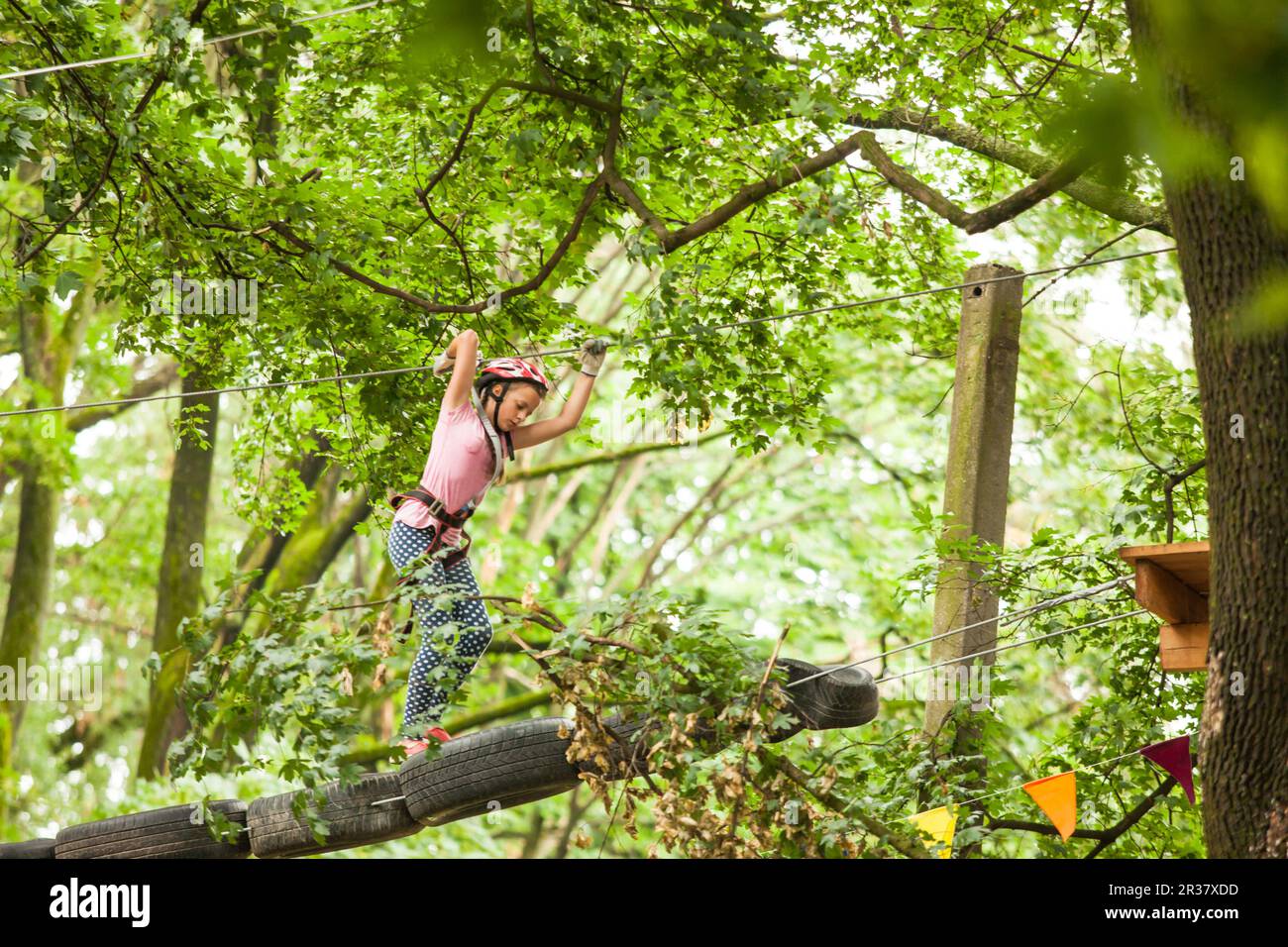 Child in a adventure playground Stock Photo - Alamy