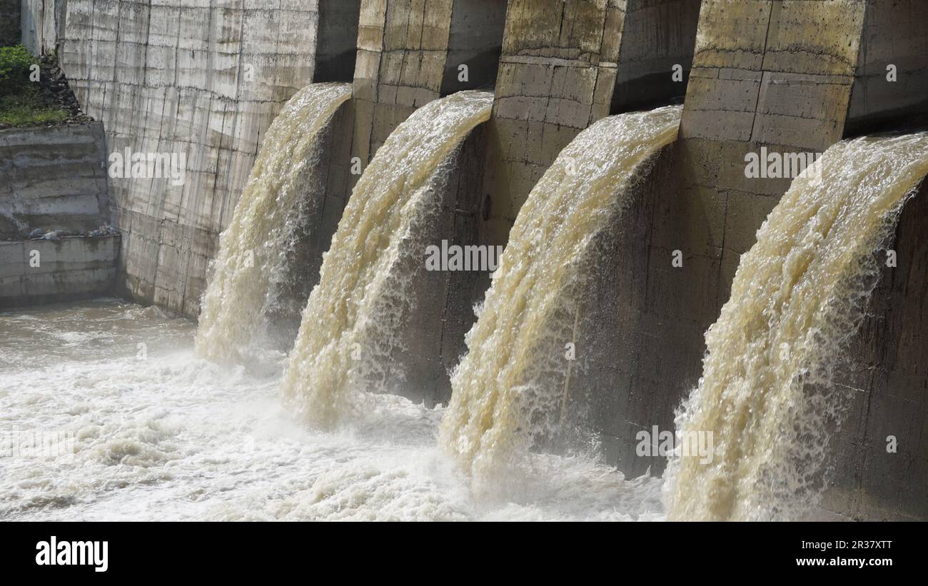 River water flows through the dam Stock Photo - Alamy