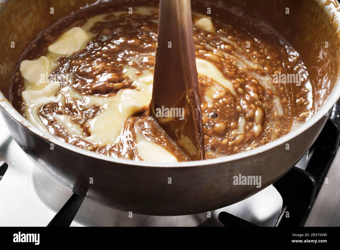 Caramel being heated in a pan Stock Photo - Alamy