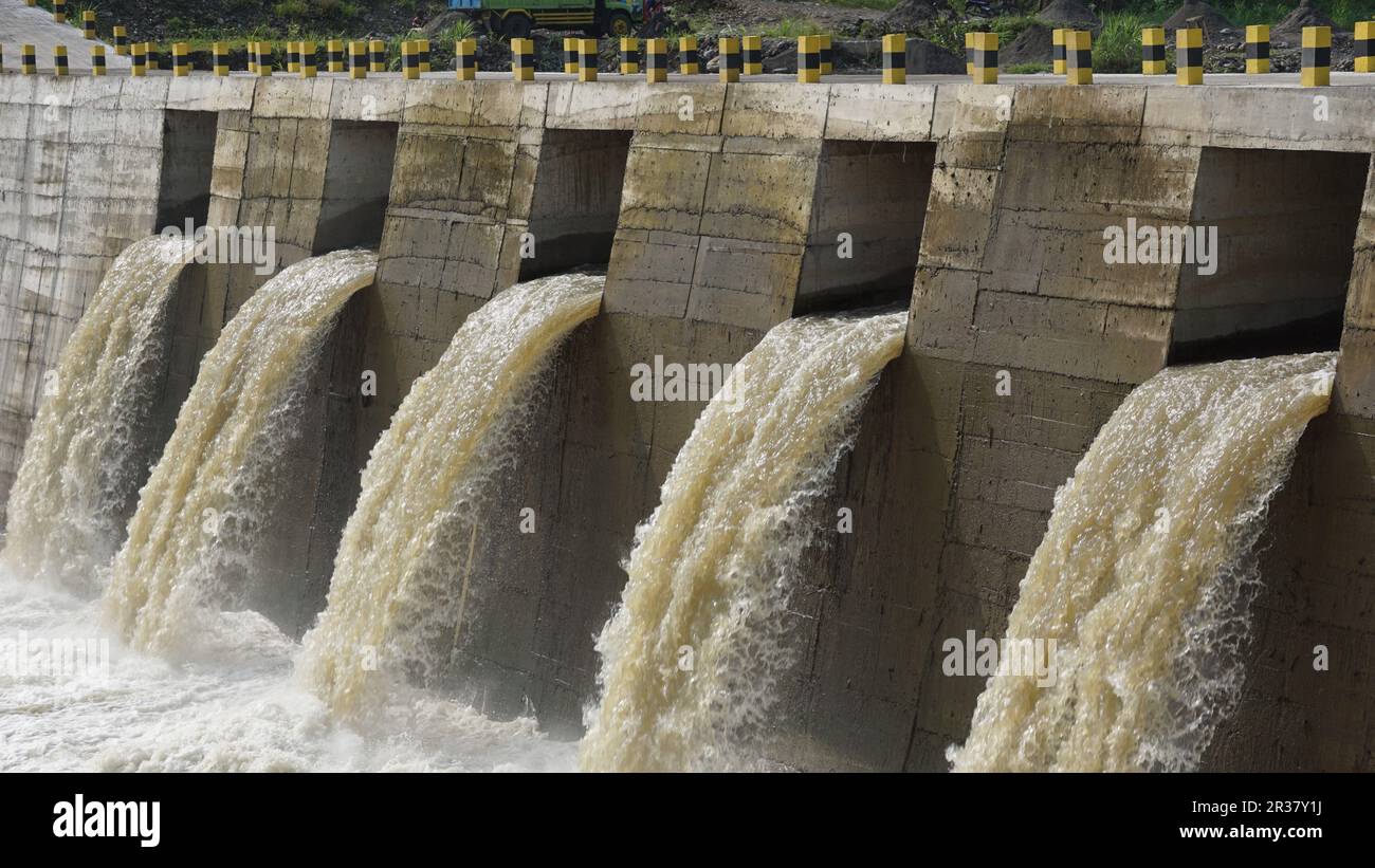 River water flows through the dam Stock Photo - Alamy