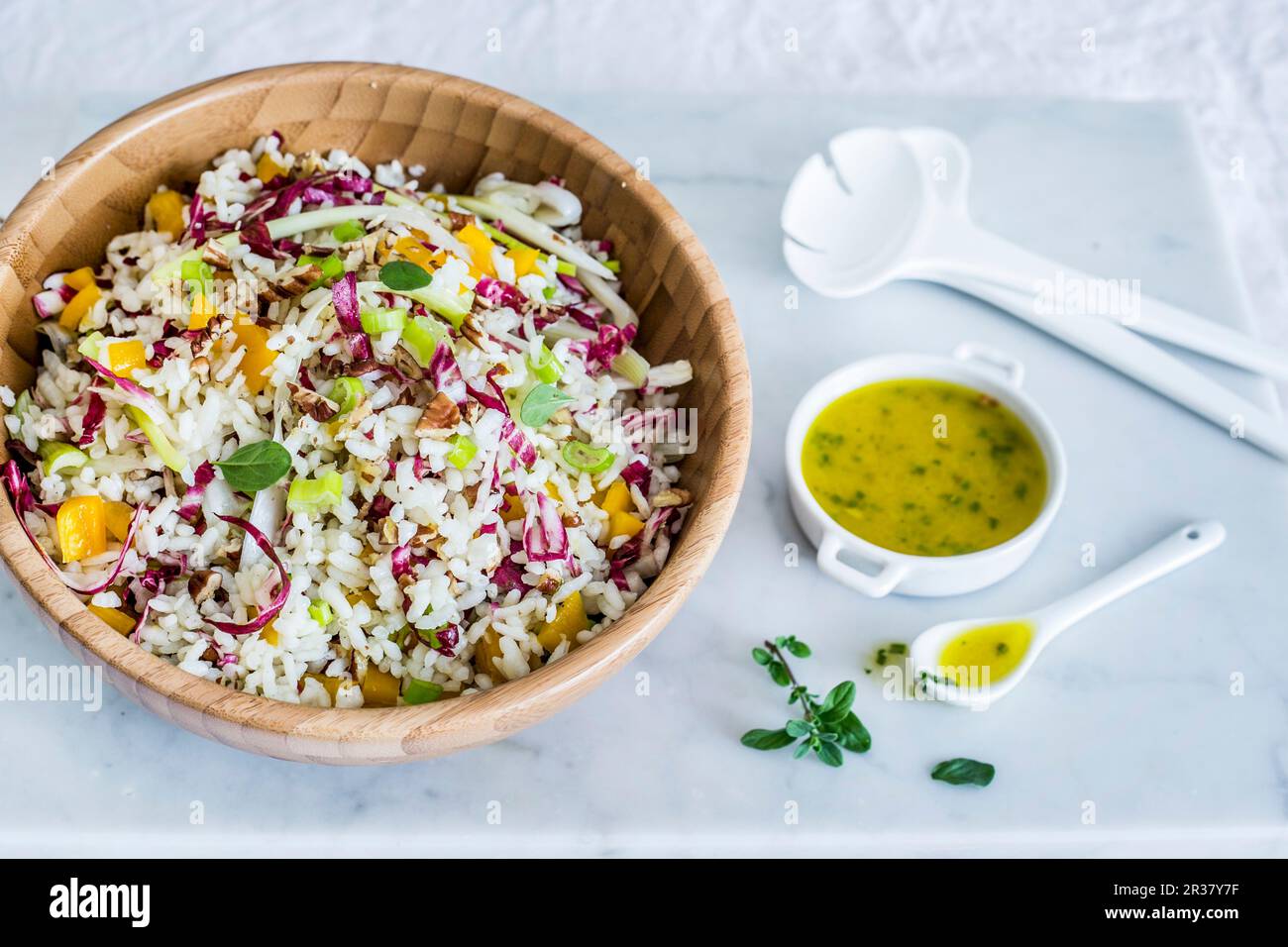 Vegan rice salad with radish and vinaigrette Stock Photo - Alamy
