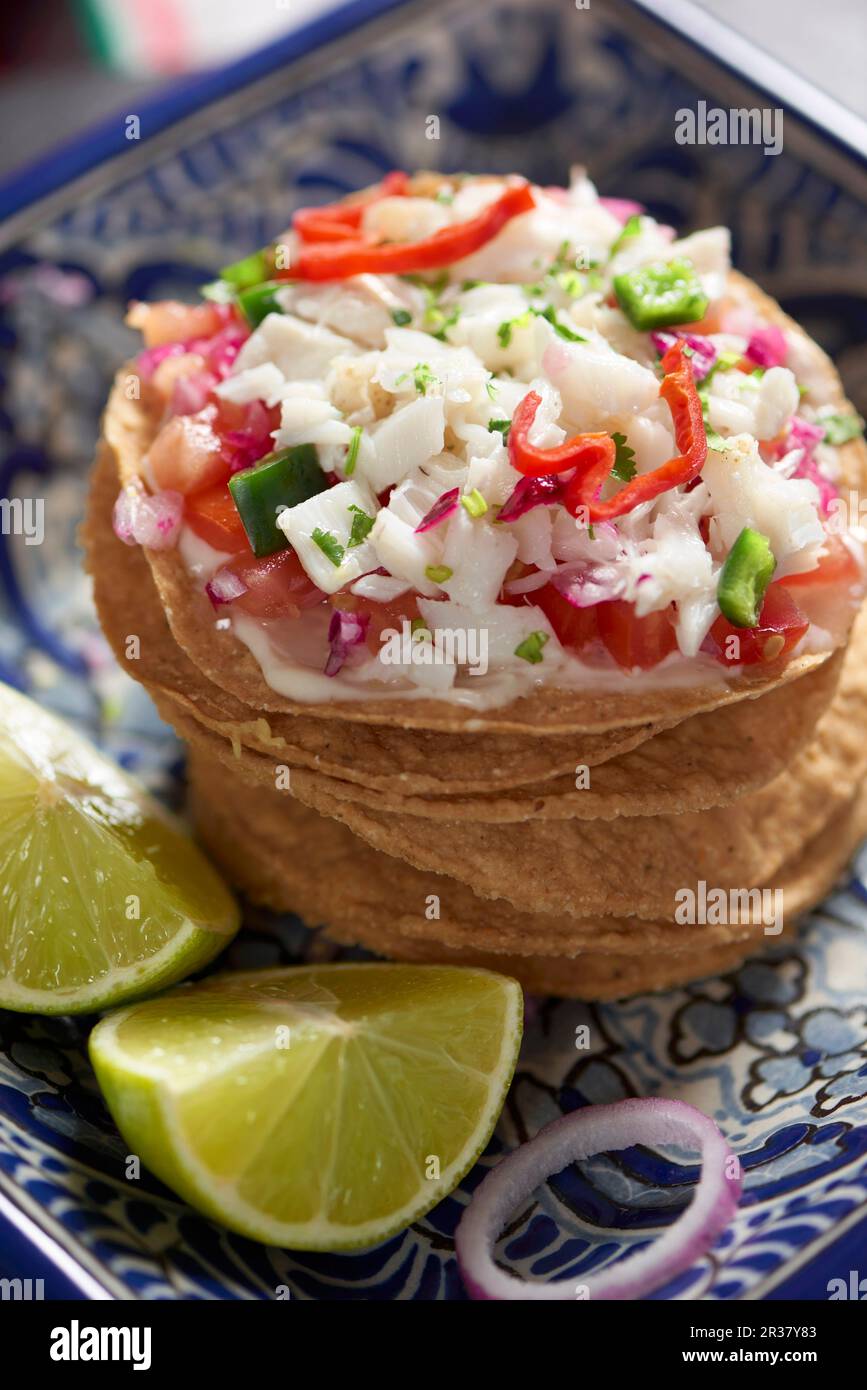Fried cod with jalapeños on a corn tostada (Mexico Stock Photo - Alamy