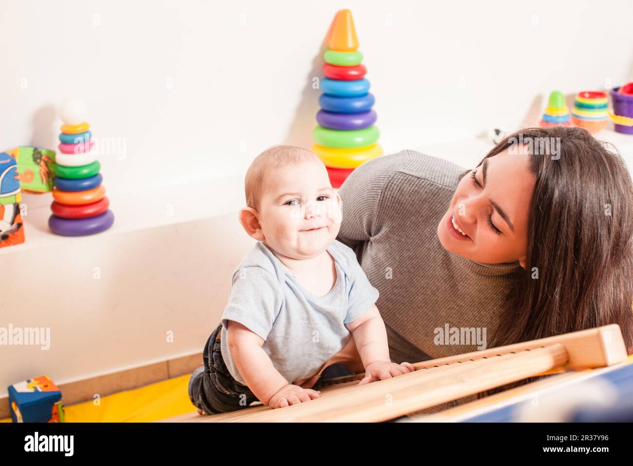 Interaction between mother and baby Stock Photo - Alamy