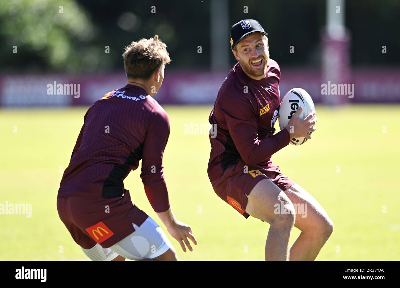 Cameron Munster (right) takes on Reece Walsh (left) during a Queensland ...