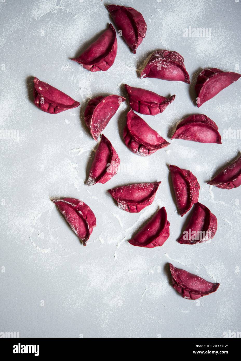 Asian beetroot dumplings on a floured work surface Stock Photo - Alamy