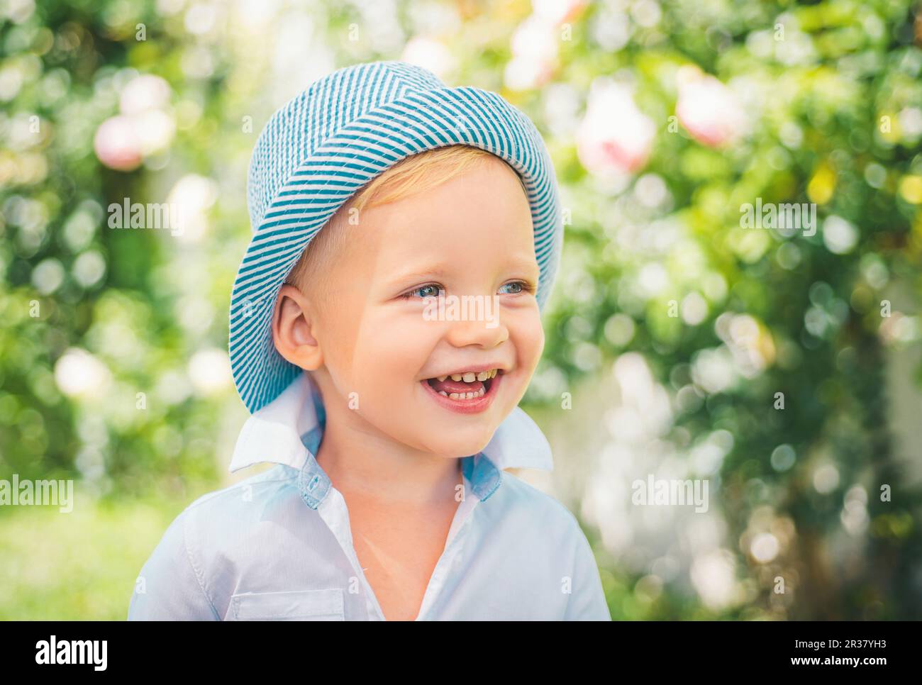 Close up portrait of cute boy smiling outdoors. Closeup headshot ...
