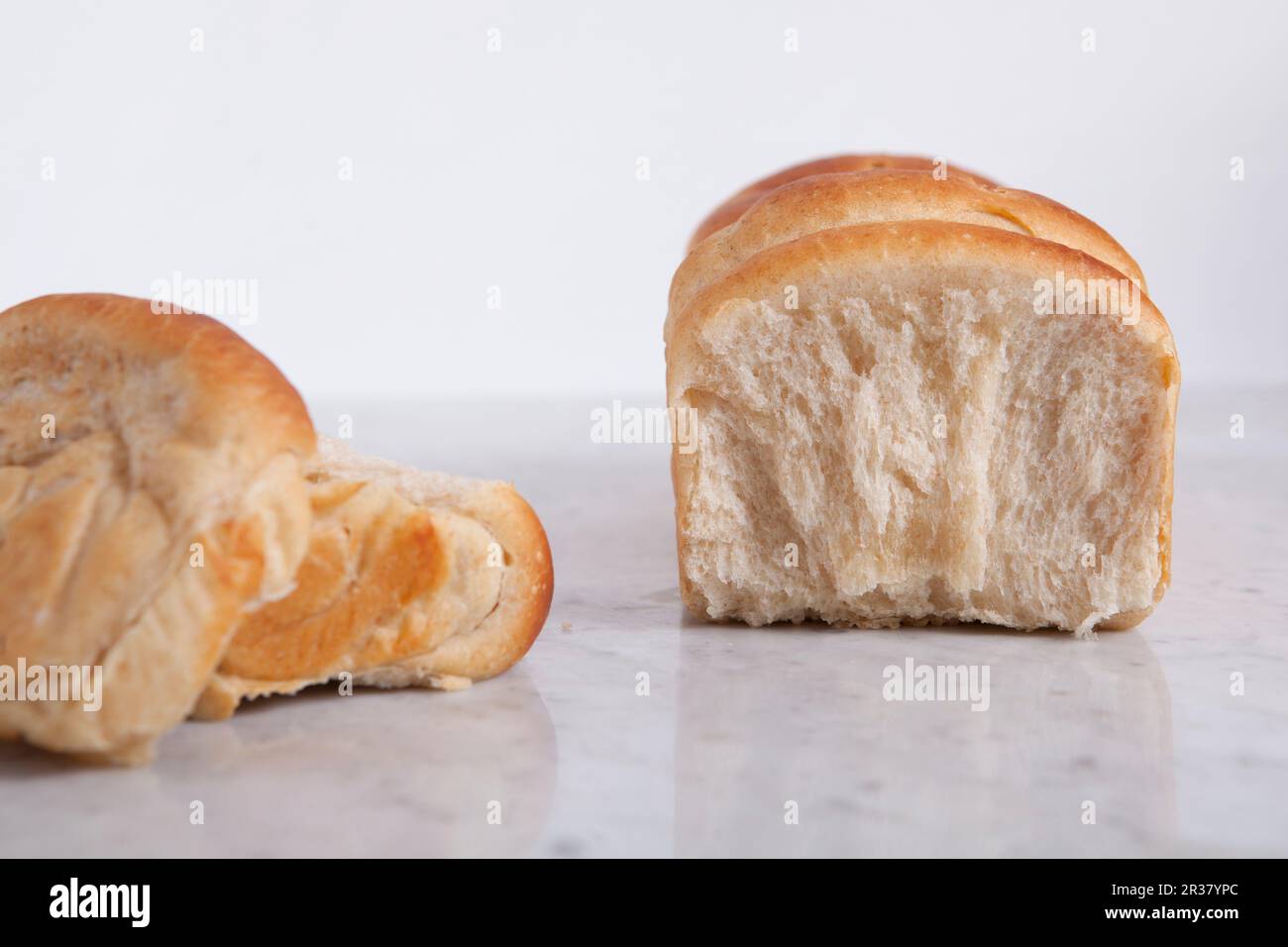 Milk bread rolls in the shape of a loaf Stock Photo - Alamy
