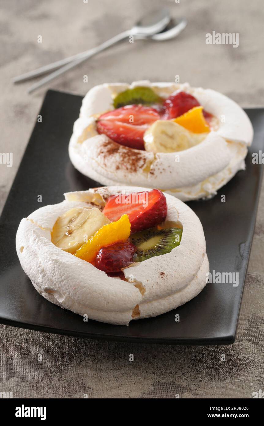 Meringue tarts with fresh fruit Stock Photo - Alamy