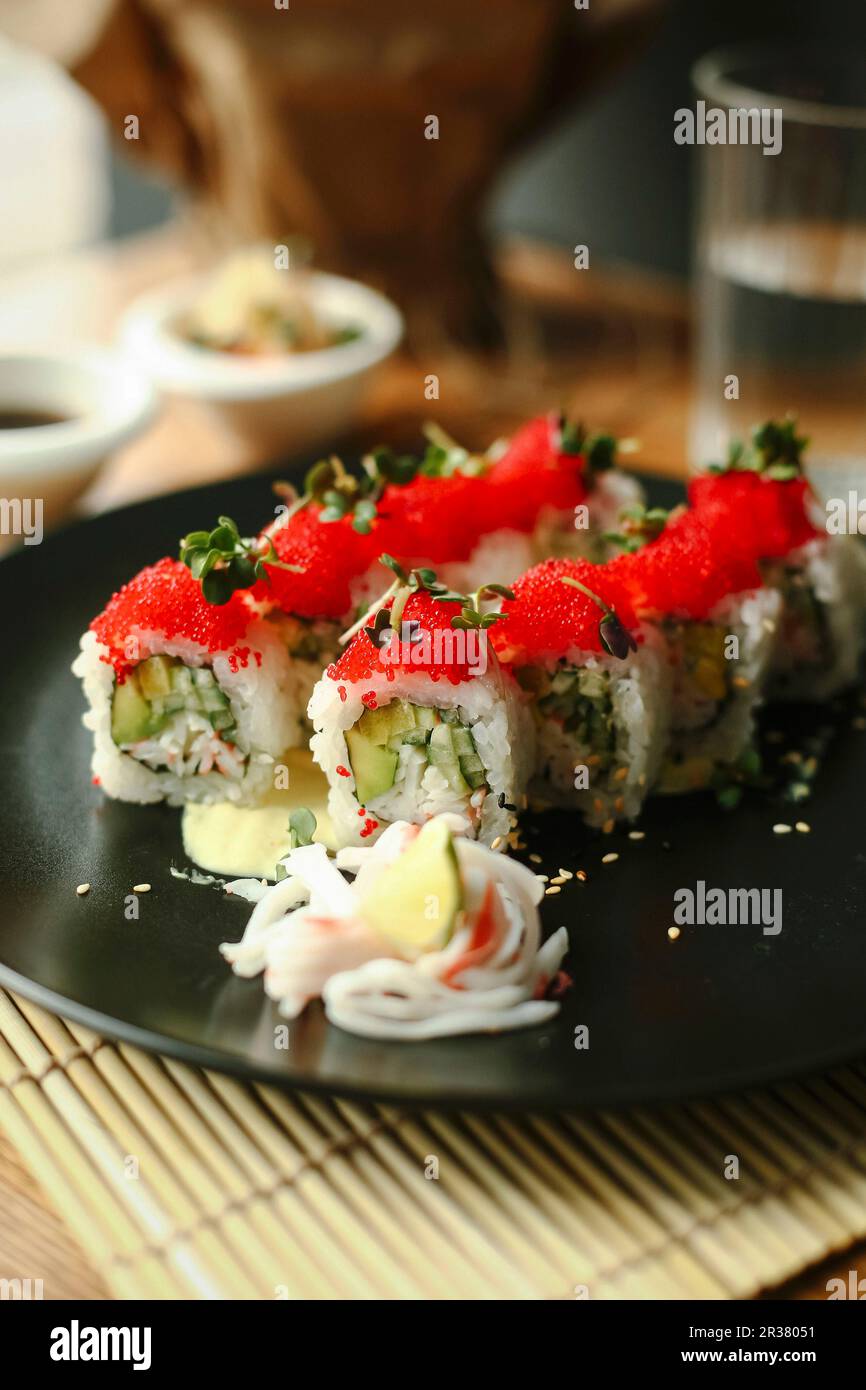 Sushi rolls with cucumber and flying fish roe Stock Photo - Alamy