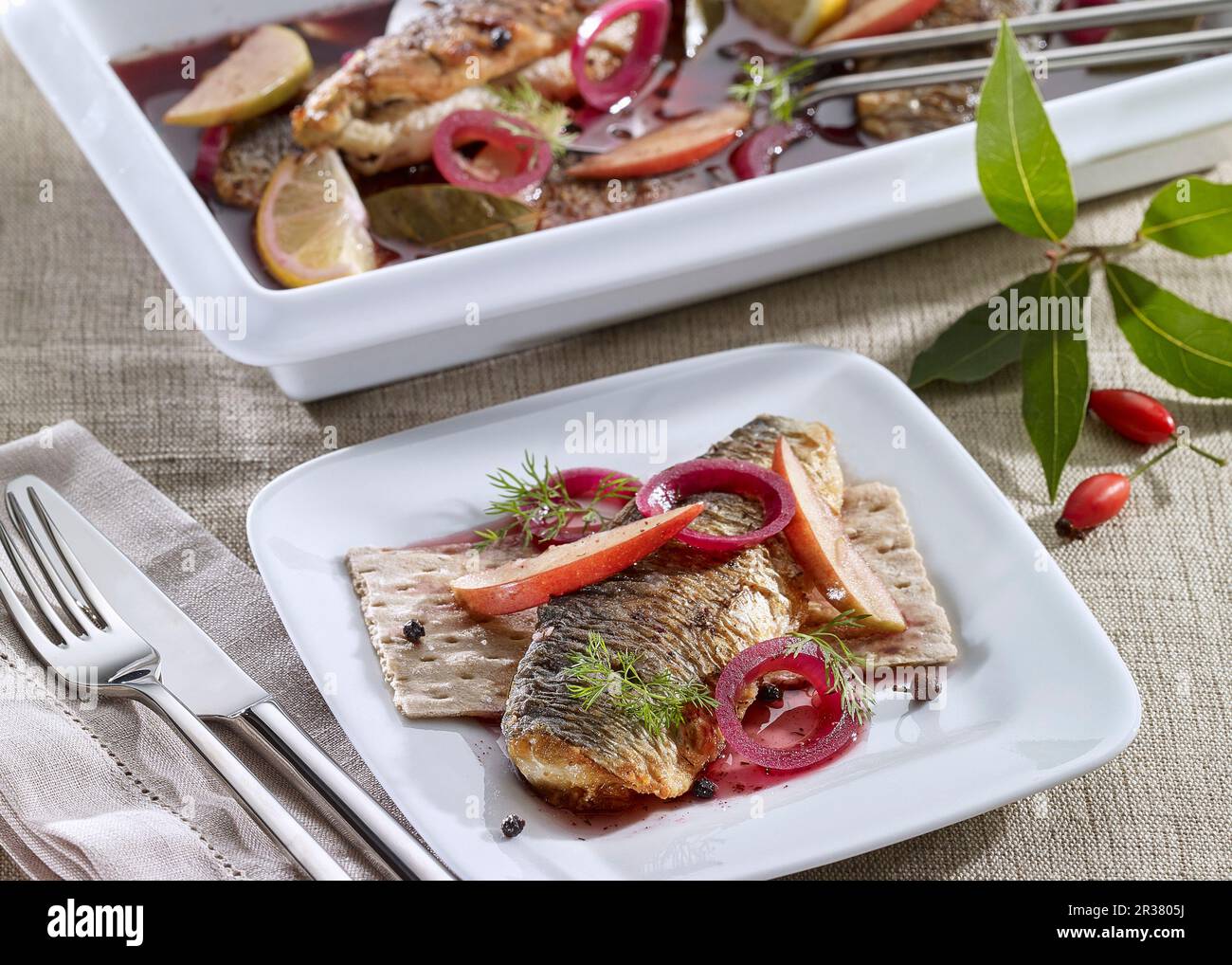 Fried herring in a rosehip marinade Stock Photo - Alamy
