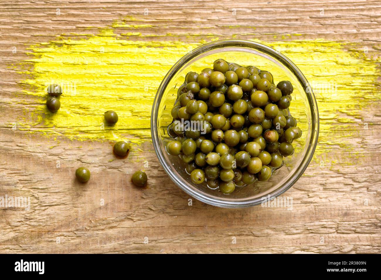 Pickled green peppercorns in a glass bowl Stock Photo - Alamy