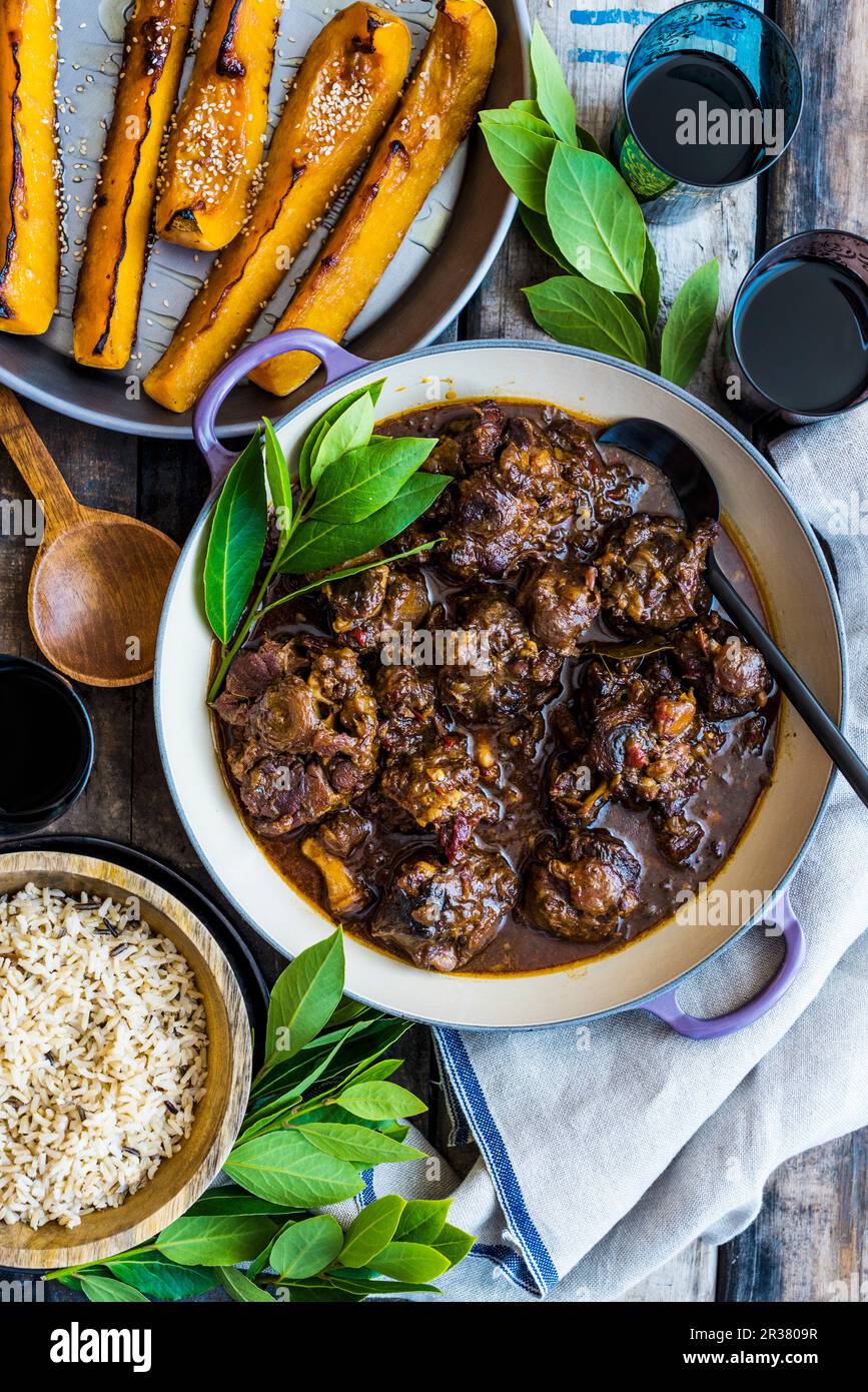 Braised ox tail with rice and pumpkin wedges (top view Stock Photo - Alamy