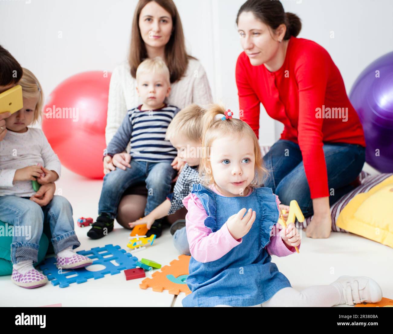 Young moms with their kids Stock Photo - Alamy