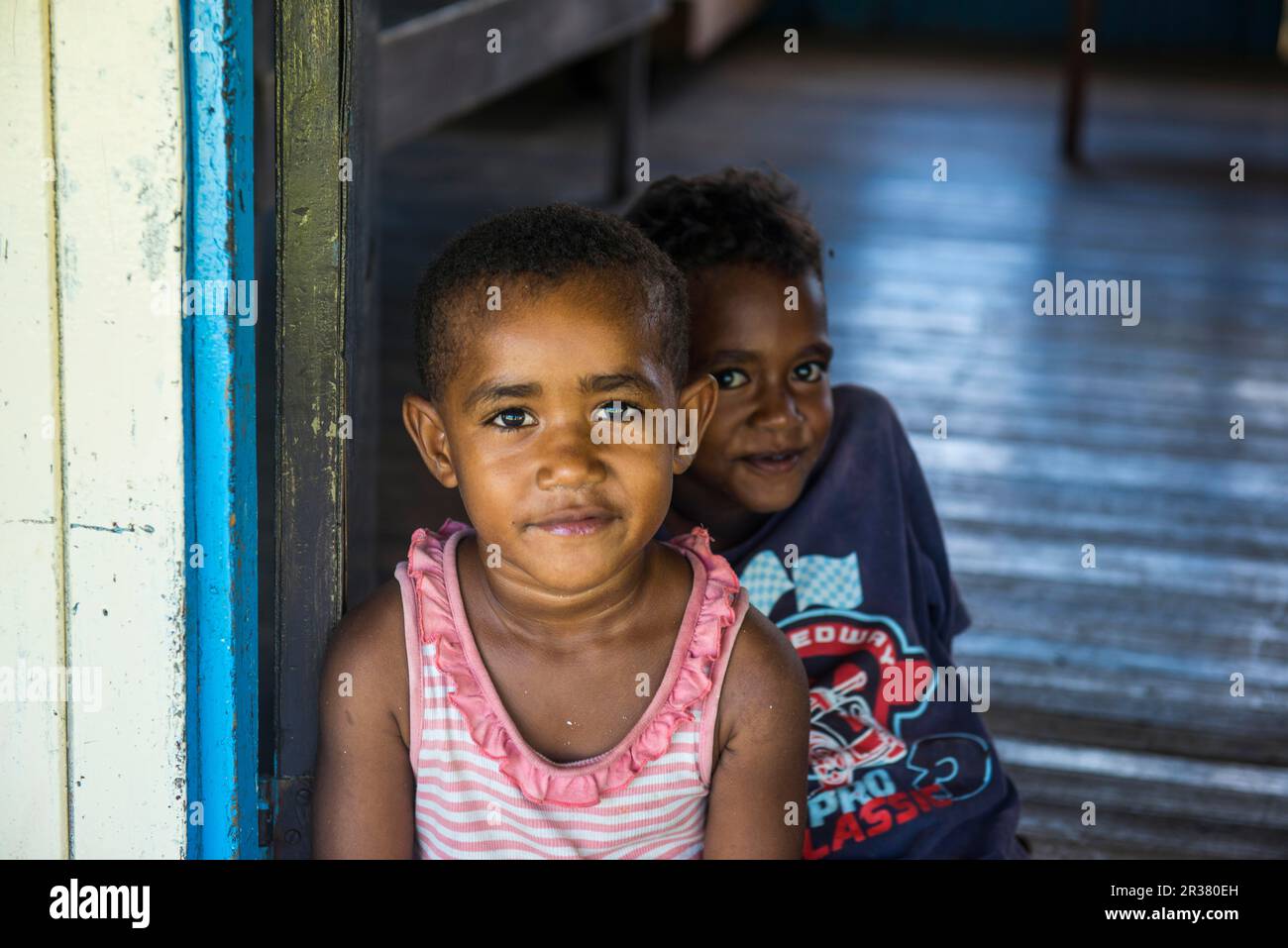School kids sitting in the entrance of a school, Yanuya island ...