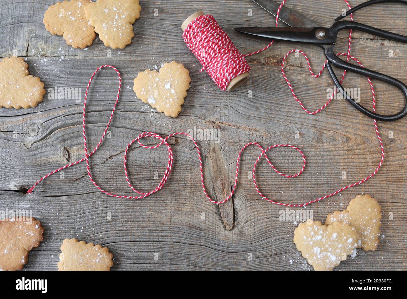 Heart shaped cookies and striped string spelling out the word 'love ...