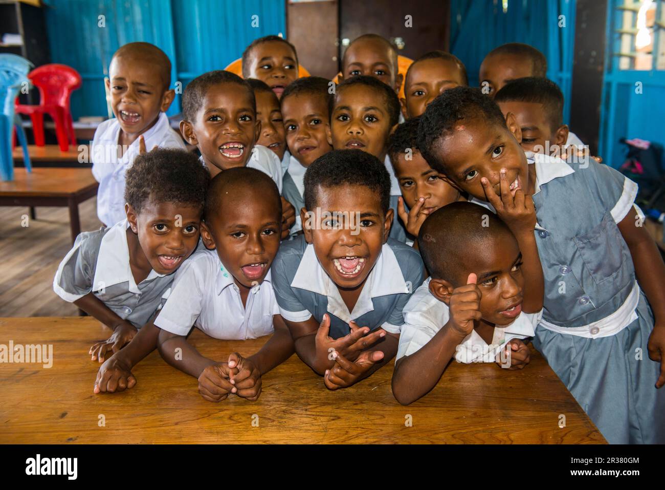 Very happy school children in a school, Yanuya island, Mamanuca islands ...
