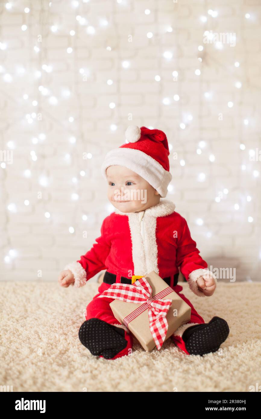Little Santa baby Stock Photo - Alamy