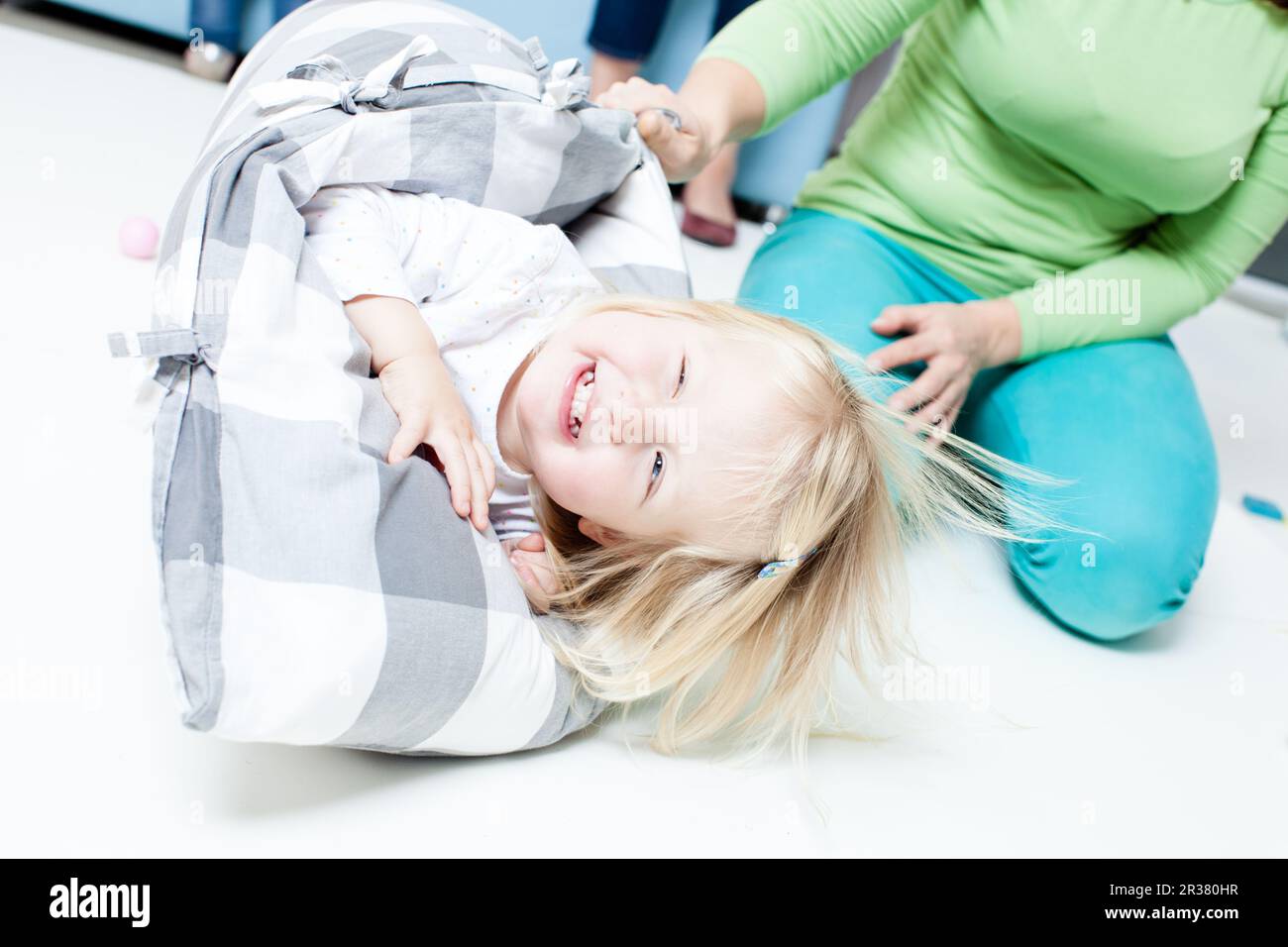 Mother is rocking her baby Stock Photo - Alamy