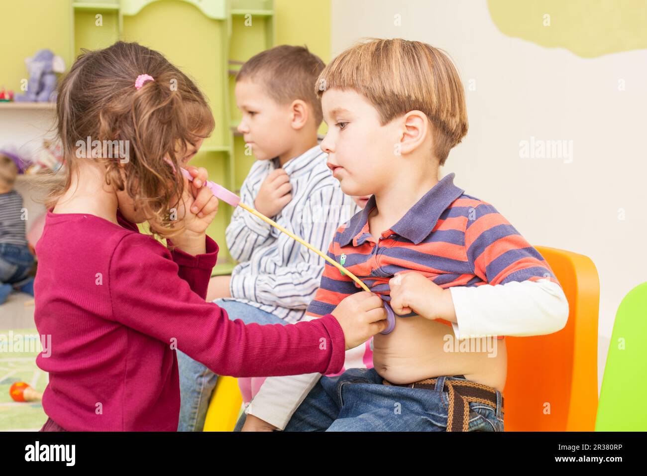 Children playing doctor and patient Stock Photo - Alamy