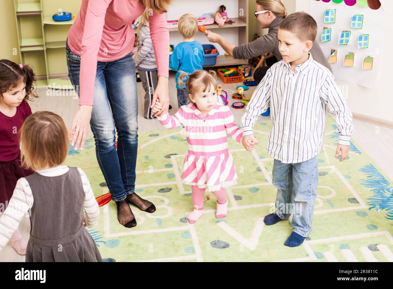 Group of little children dancing Stock Photo - Alamy