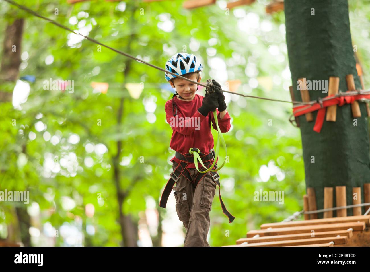 Child in a adventure playground Stock Photo - Alamy