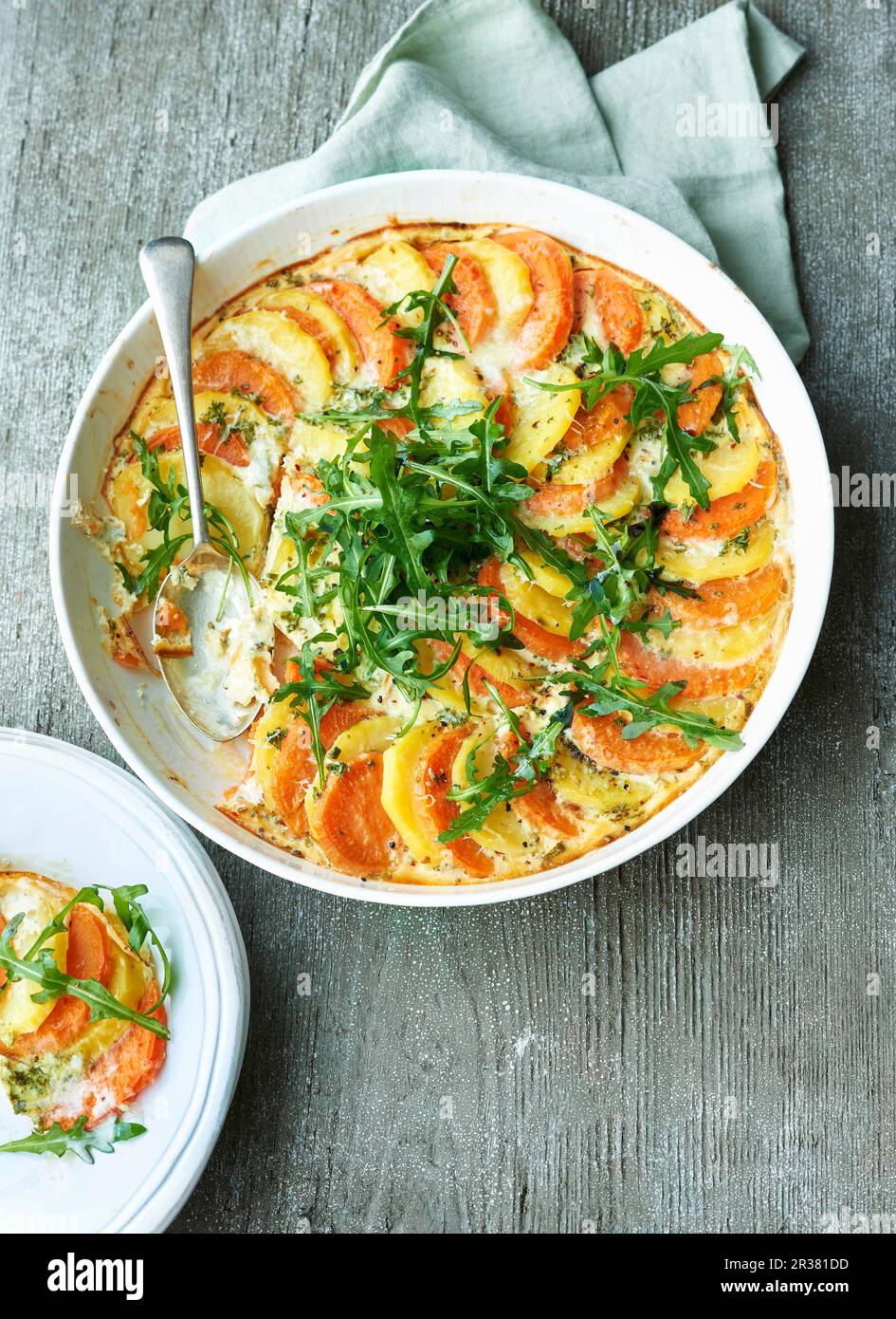 A potato bake with fresh rocket Stock Photo - Alamy