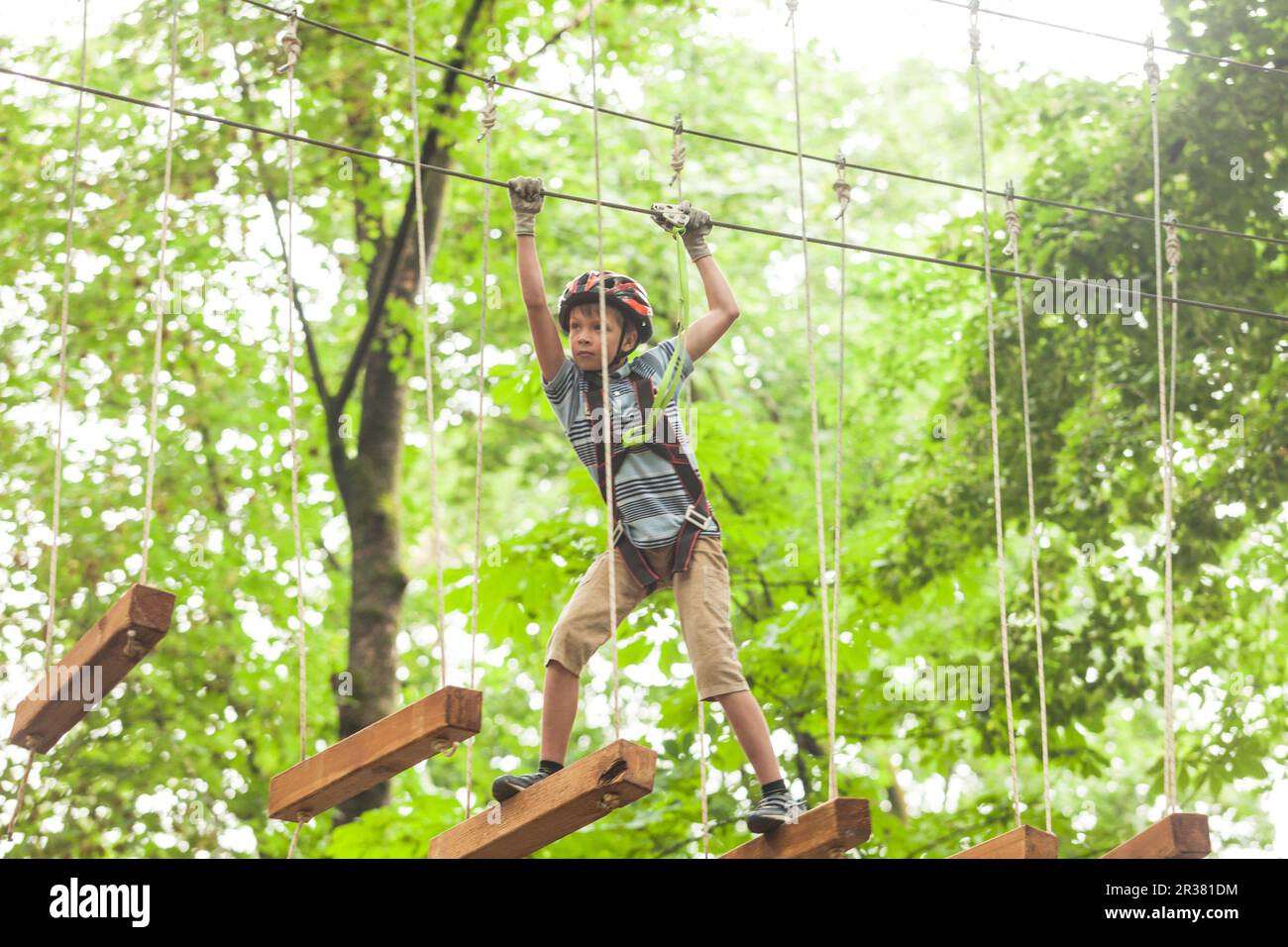 Child in a adventure playground Stock Photo - Alamy