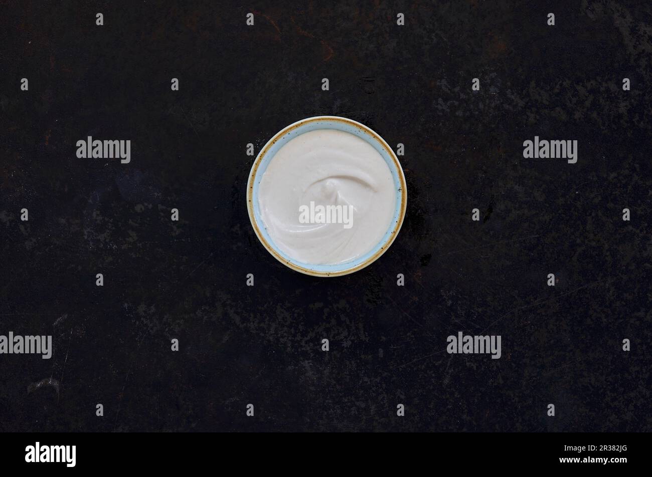 Tahini in a small bowl (sesame paste, Lebanon Stock Photo - Alamy