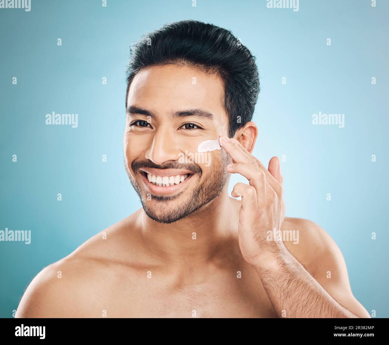 Skincare, beauty and man with face cream in a studio for a natural ...