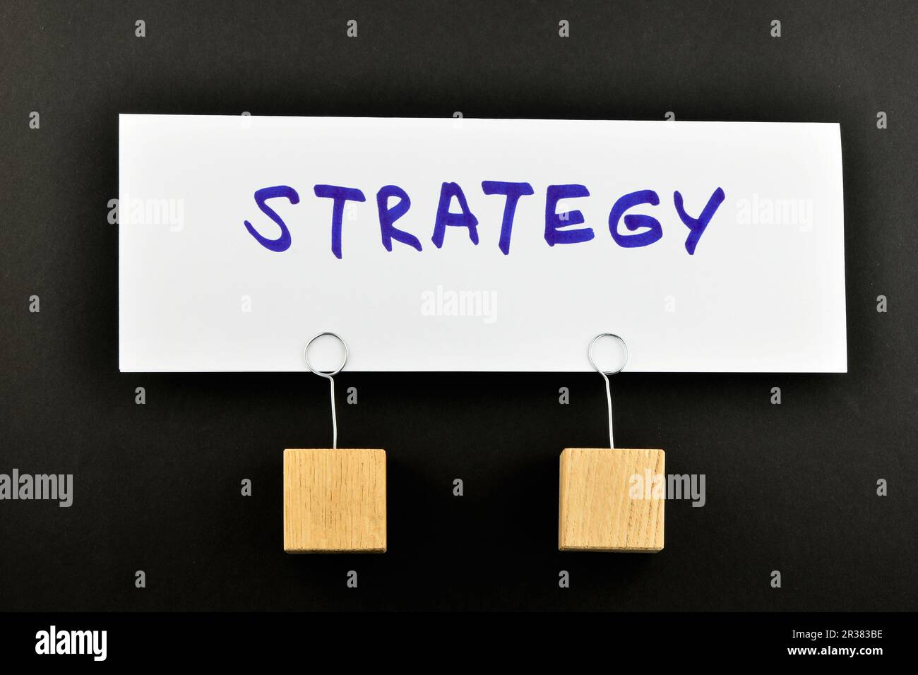 Strategy, One big paper note on black for presentation Stock Photo - Alamy