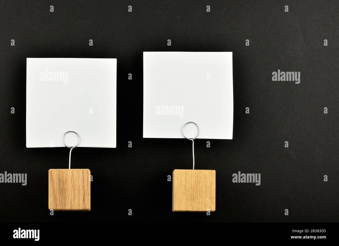 Two paper notes with holders on black background for presentation Stock ...