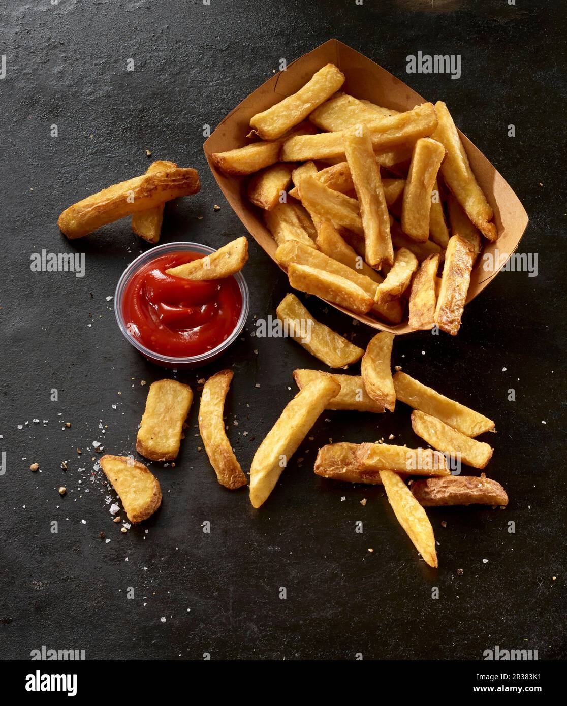 French fries in a cardboard box with ketchup Stock Photo - Alamy