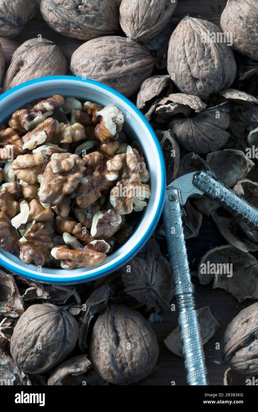 Organic walnuts, a nutcracker and nut shells Stock Photo - Alamy