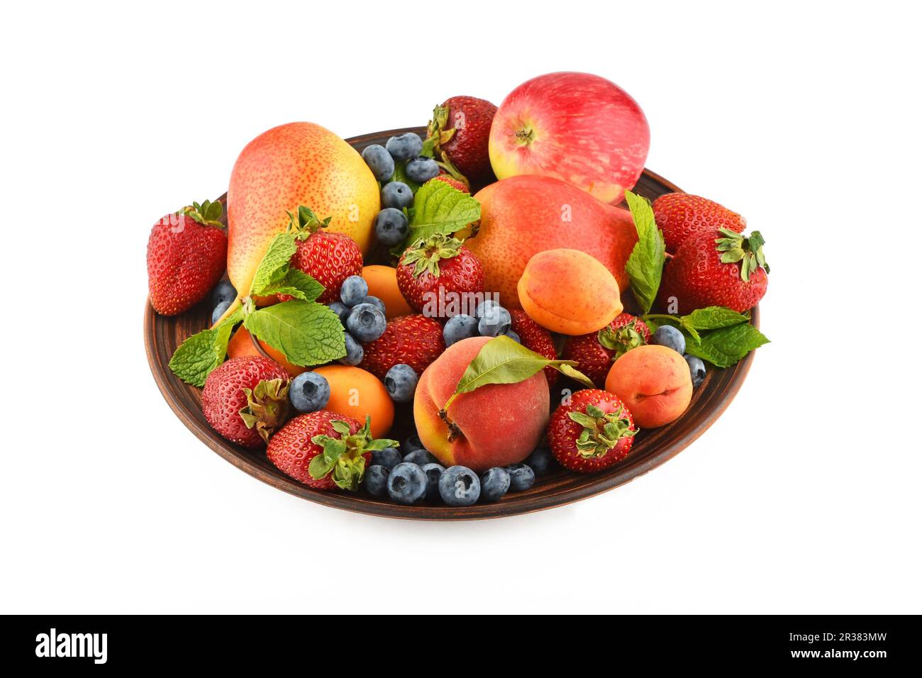 Fruits and berries mix in ceramic plate isolated on white Stock Photo ...