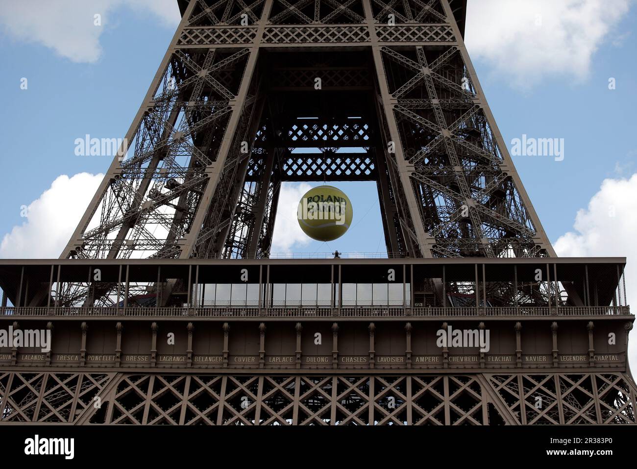 FILE - A giant tennis ball is hung under the second floor of the Eiffel ...