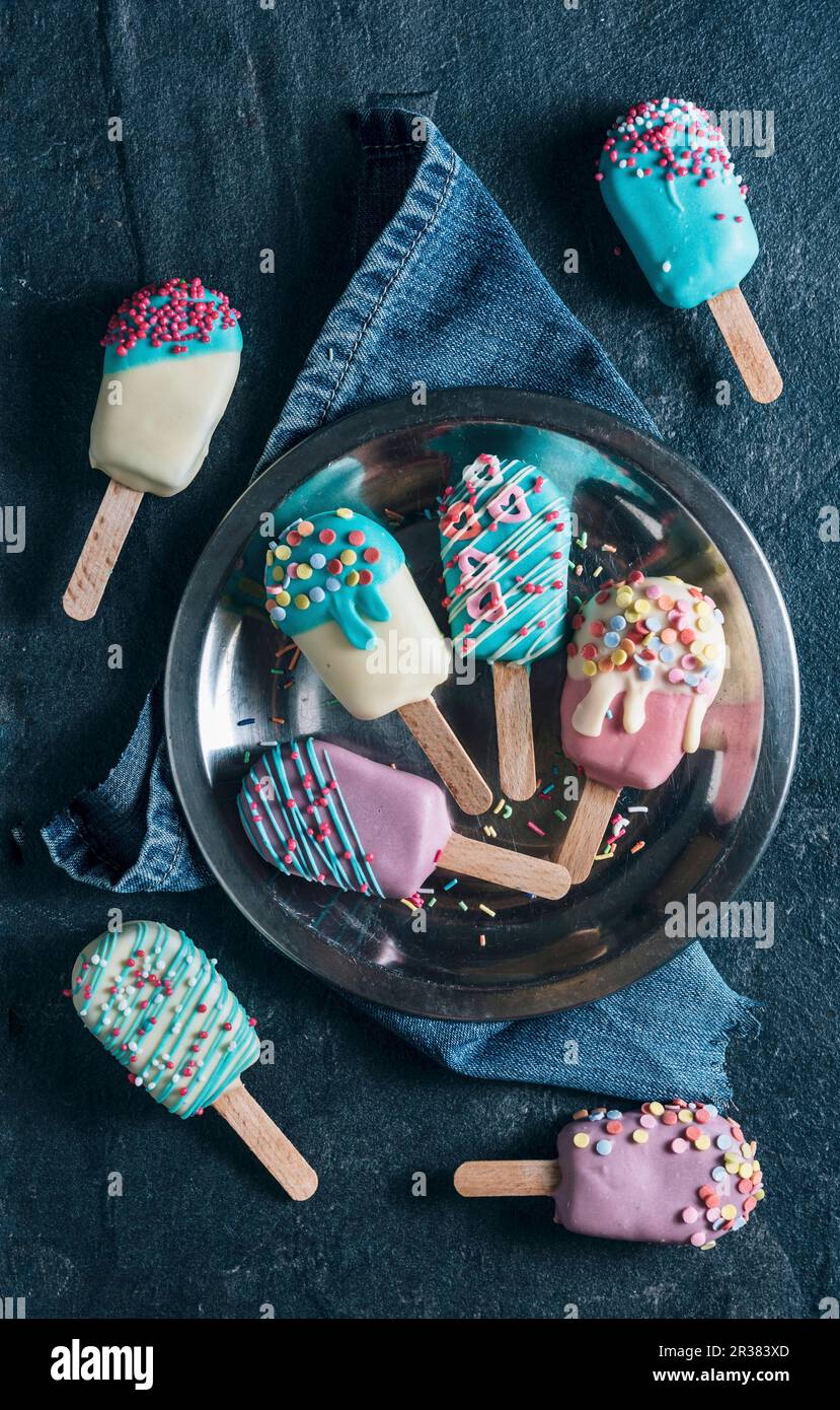 Cake pops in the shape of ice lollies with brightly coloured icing ...