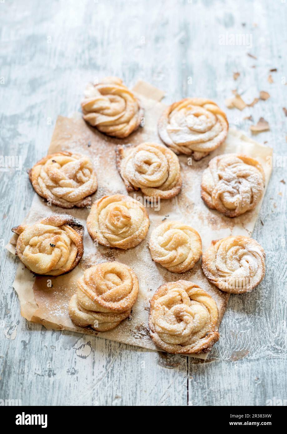 Rose-shaped pastries with cinnamon and icing sugar Stock Photo - Alamy