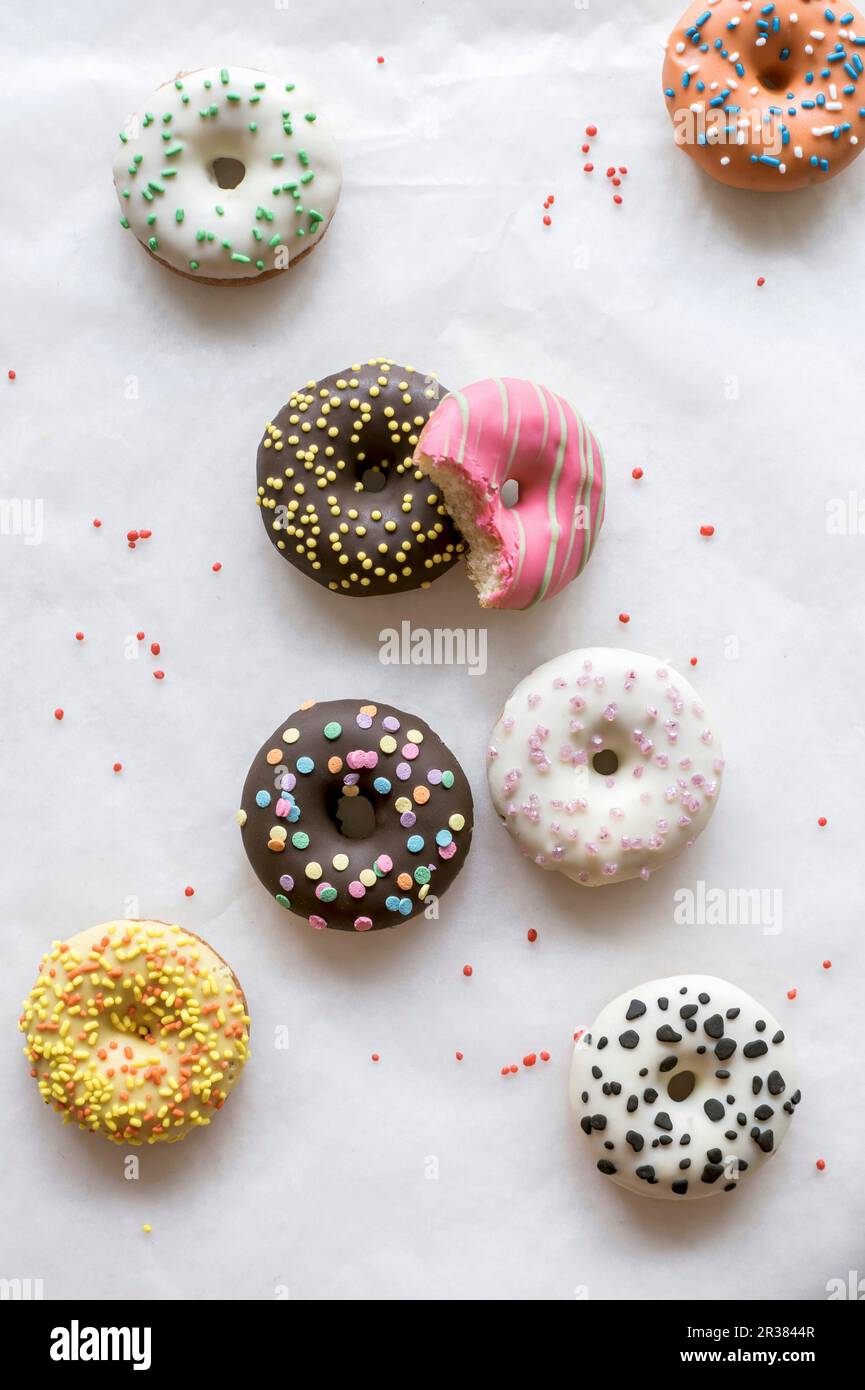 Mini American donuts splashed on the white background Stock Photo - Alamy