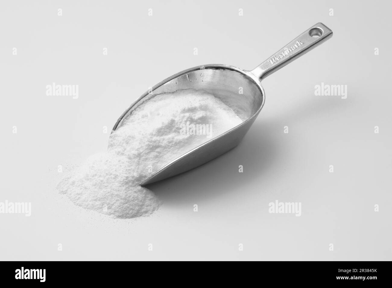 Milk powder on a metal scoop Stock Photo - Alamy