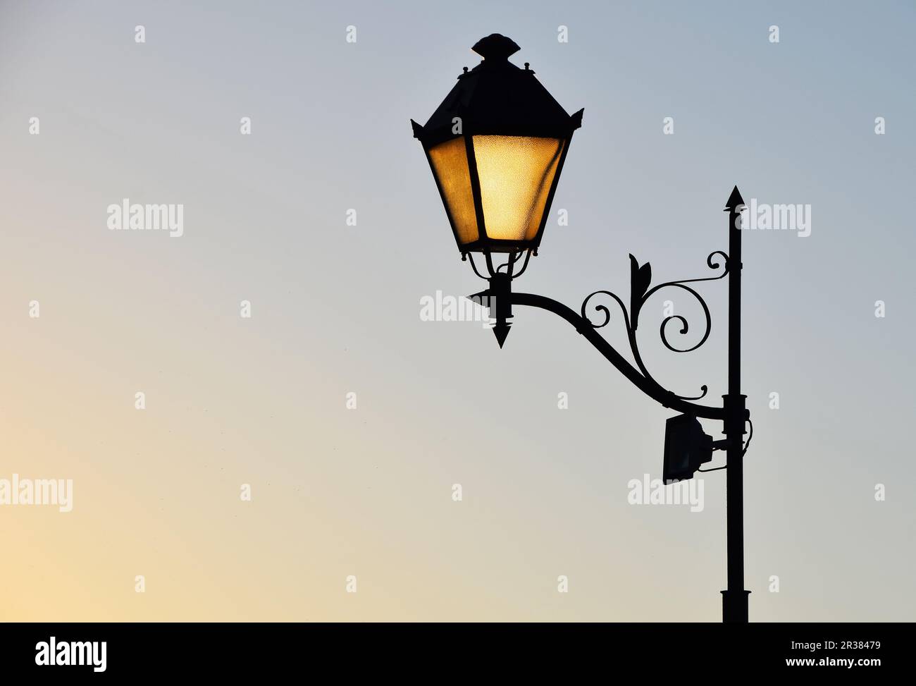 Street antique style lamp post with effect of shine from low light of ...