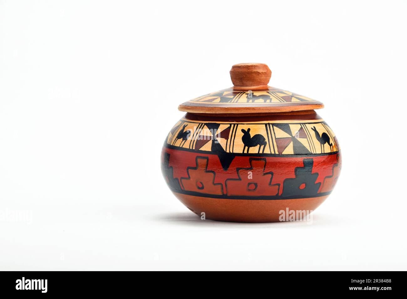Painted handmade ceramic pot with lid isolated on white Stock Photo - Alamy