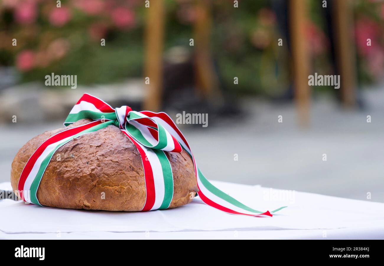 A loaf of bread wrapped with red, white and green ribbon Stock Photo ...