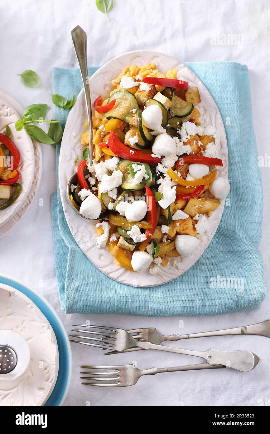 Savoury Kaiserschmarrn (shredded pancake from Austria) with sliced ...