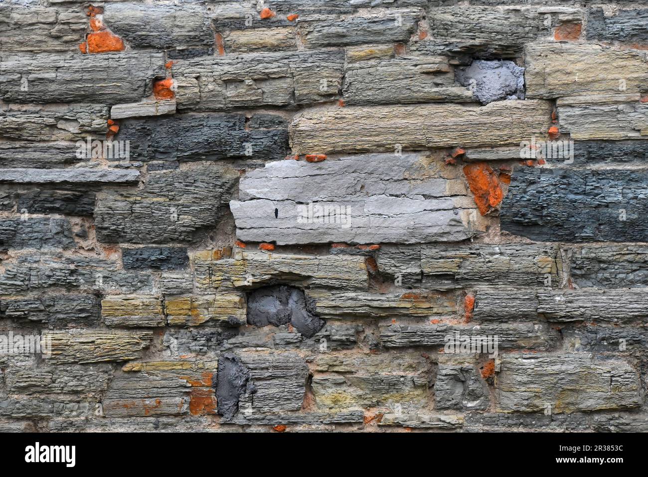 Old stone layered wall Stock Photo - Alamy