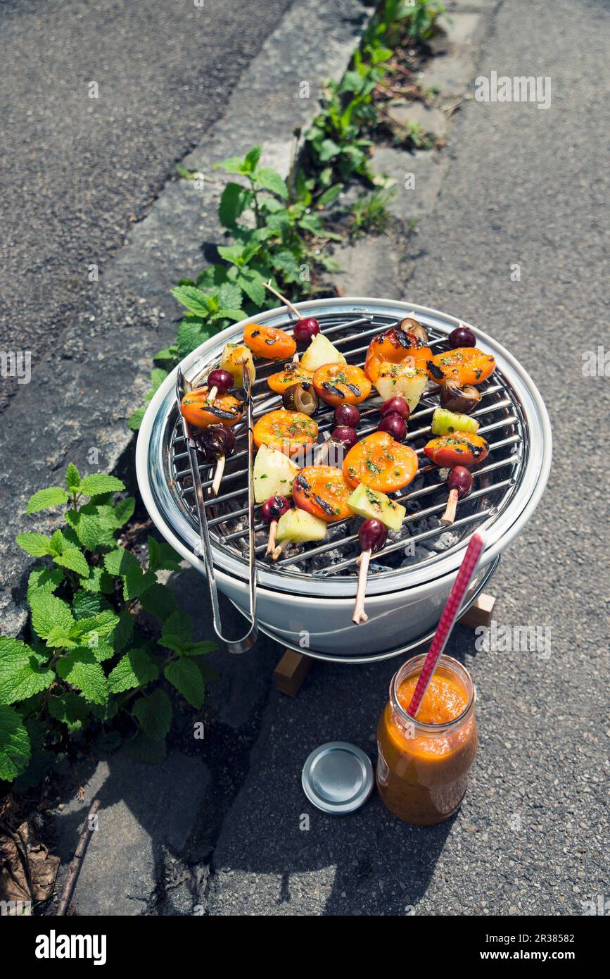 Grilled fruit skewers with sweet BBQ sauce Stock Photo - Alamy