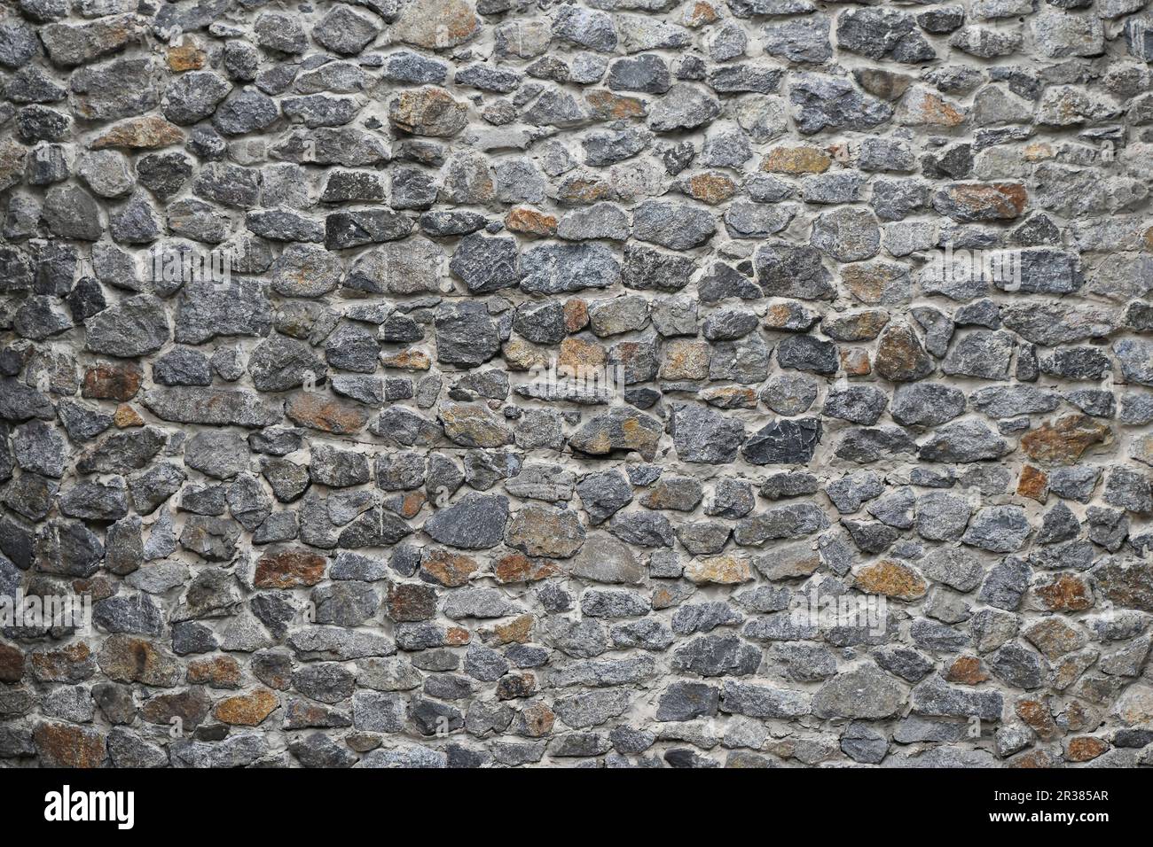 Old stone layered wall Stock Photo - Alamy