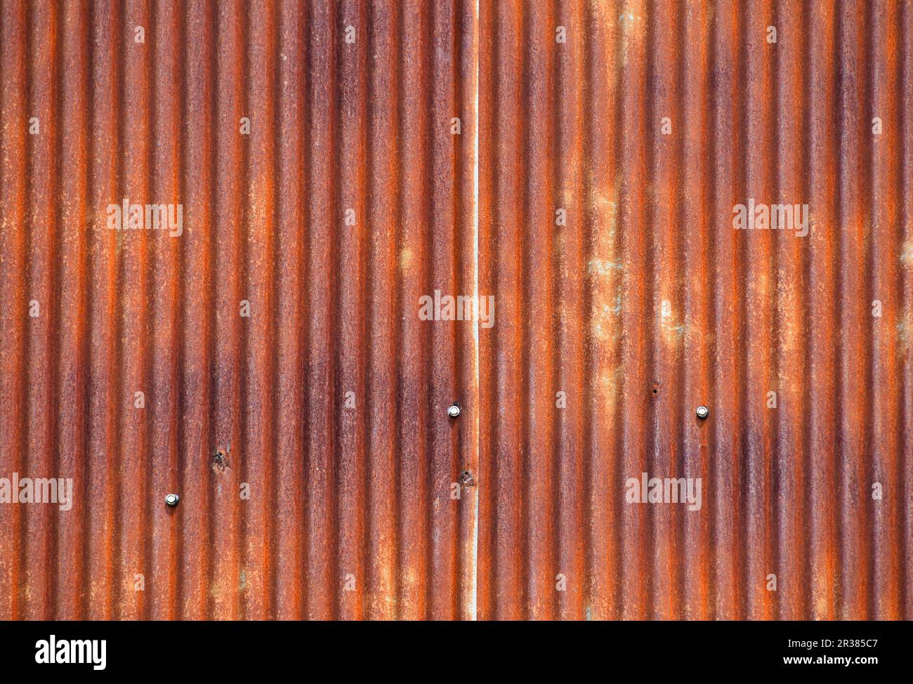 Old bright rust corroded metal goffered surface Stock Photo - Alamy