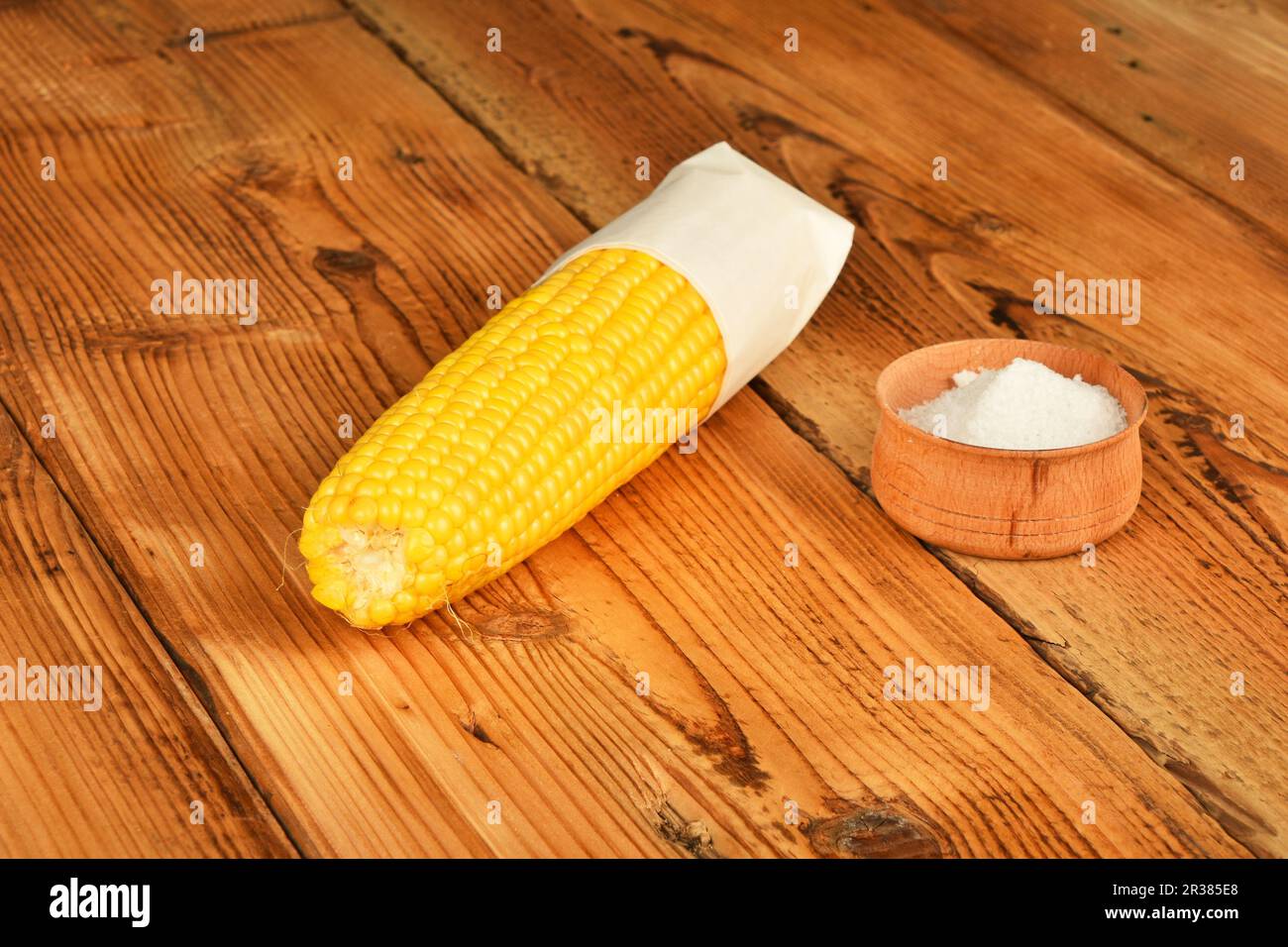 One corn cob and salt on vintage wood Stock Photo - Alamy